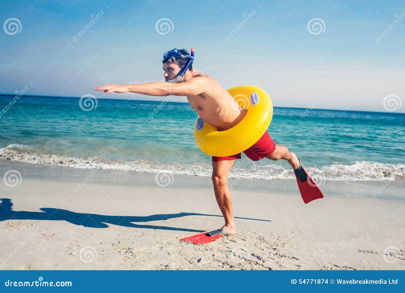 Man Wearing Flippers and Rubber Ring at the Beach Stock Photo - Image ...