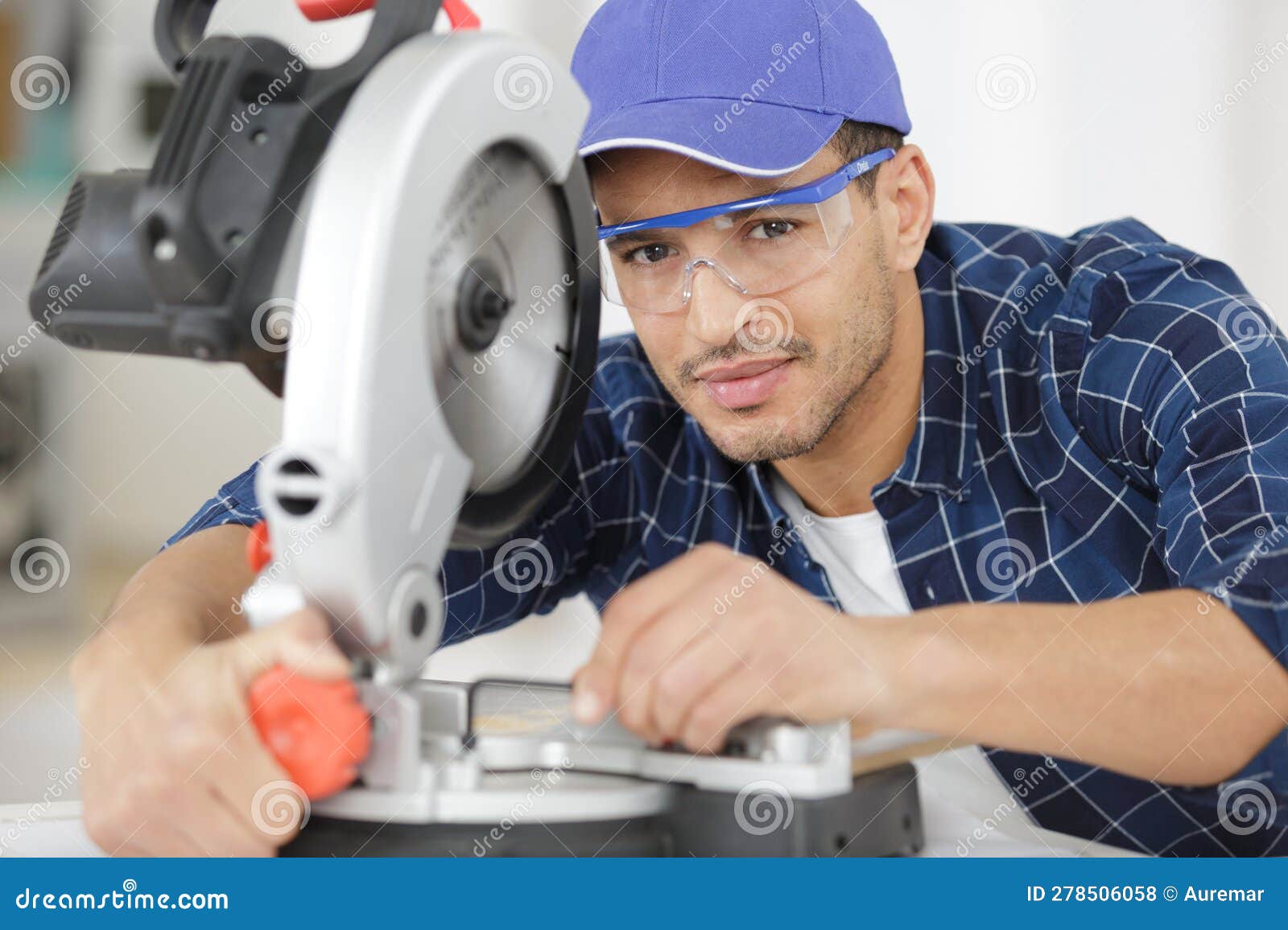 Man Wearing Goggles Working with Table Saw Stock Photo - Image of ...