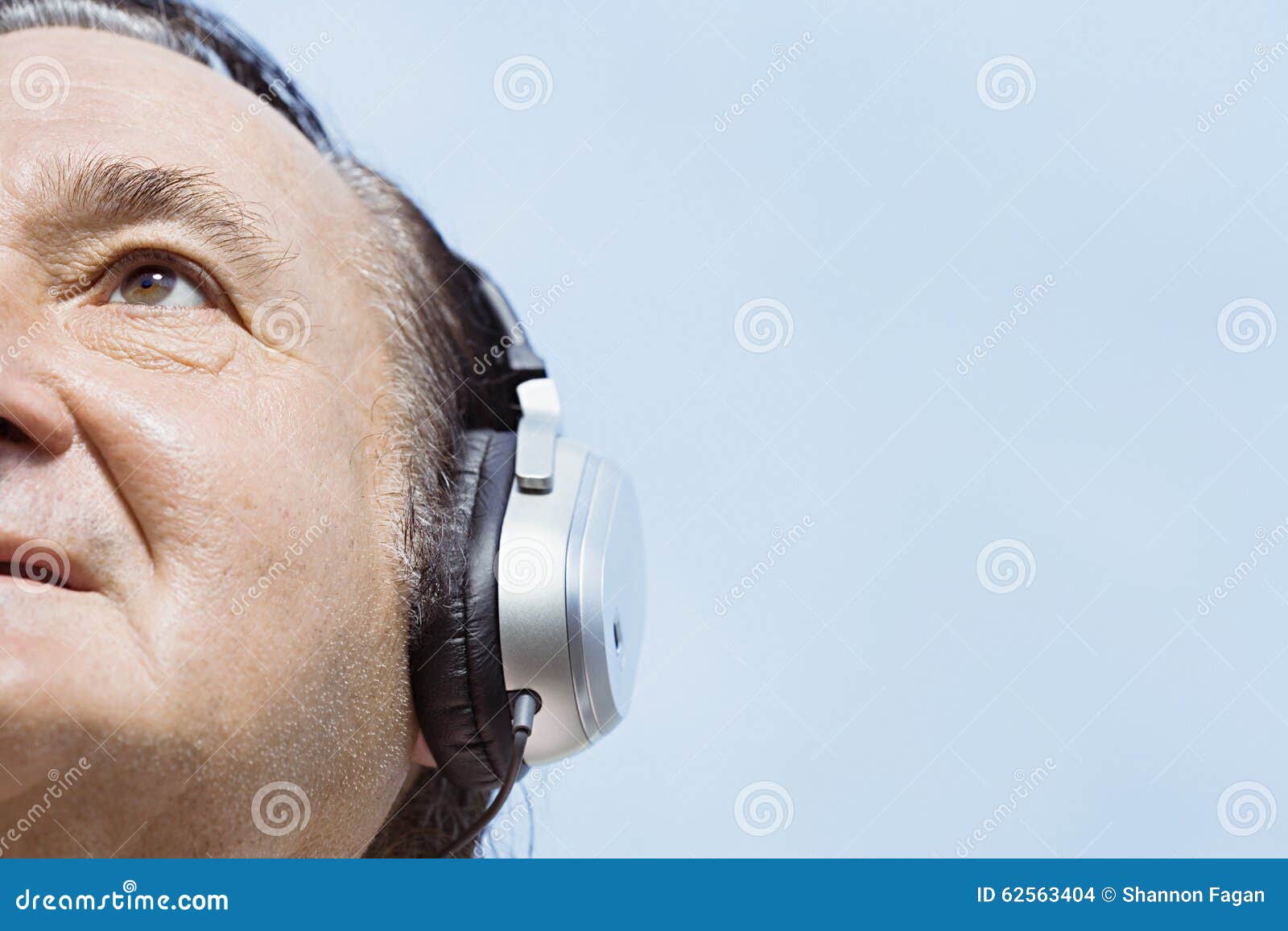 Man wearing headphones stock photo. Image of contemplation - 62563404