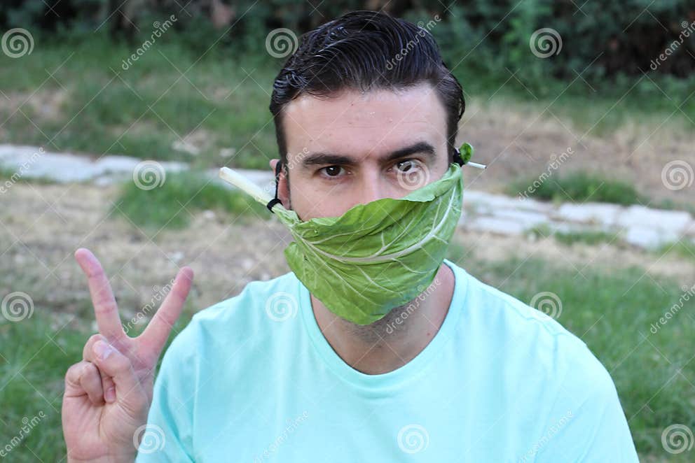 Man Wearing Leaf As Protective Face Mask Stock Photo - Image of fresh ...