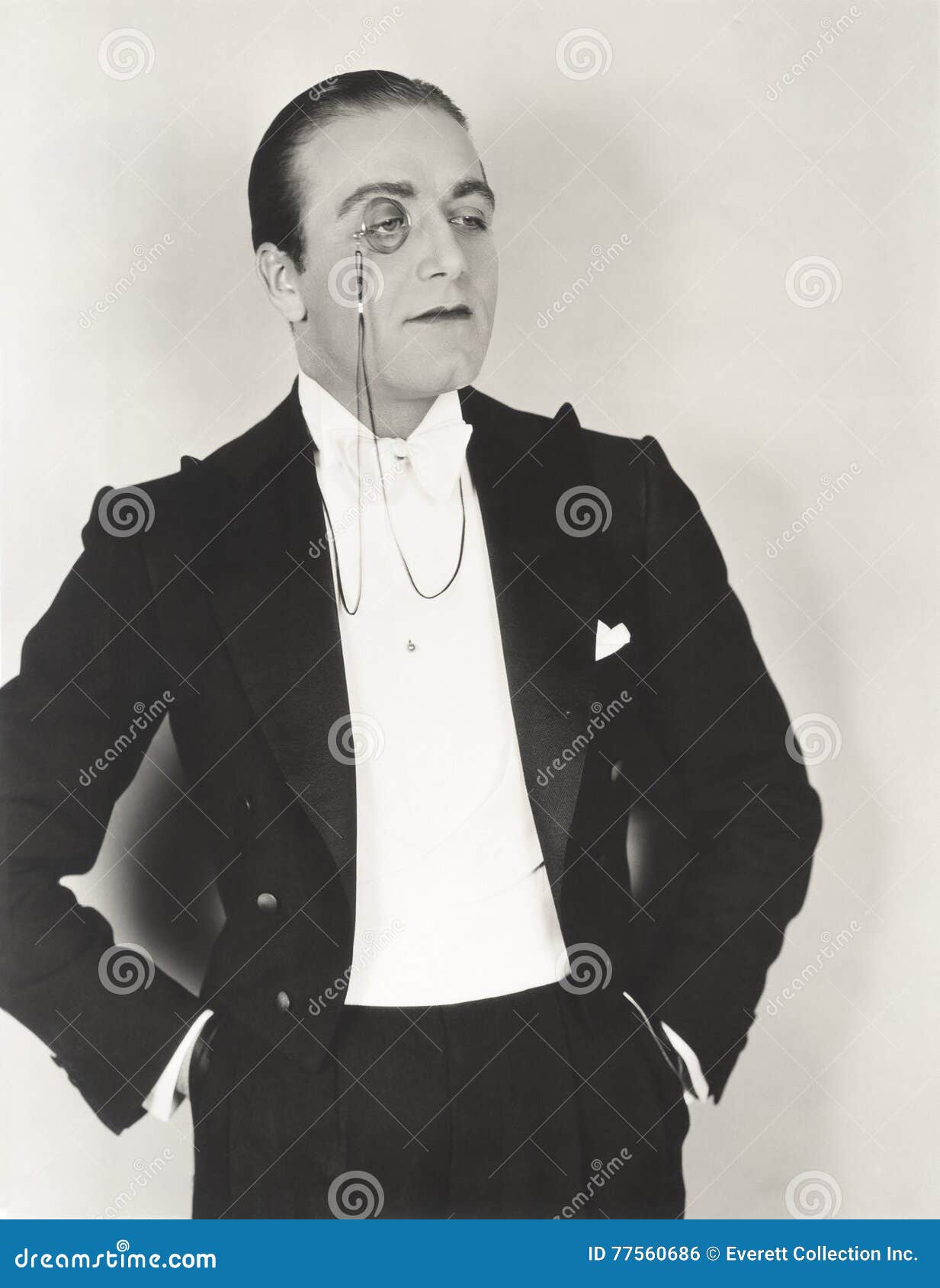 Man Wearing Monocle and Tuxedo with Hands in Pockets Stock Photo ...