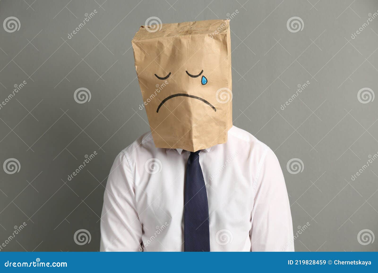 Man Wearing Paper Bag with Drawn Sad Face on Grey Background Stock ...