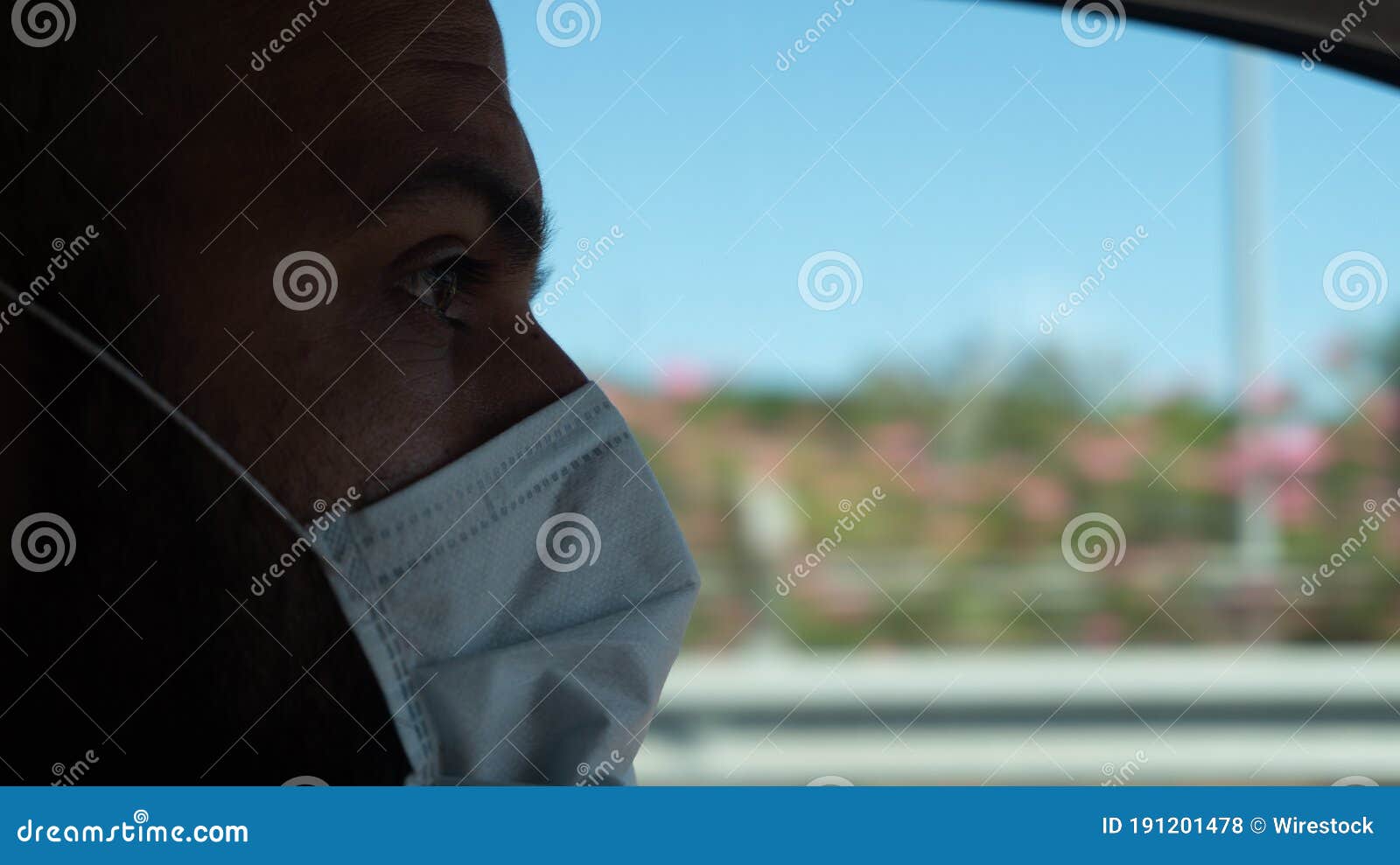 Man Wearing a Protective White Face Mask while Driving a Car Stock ...