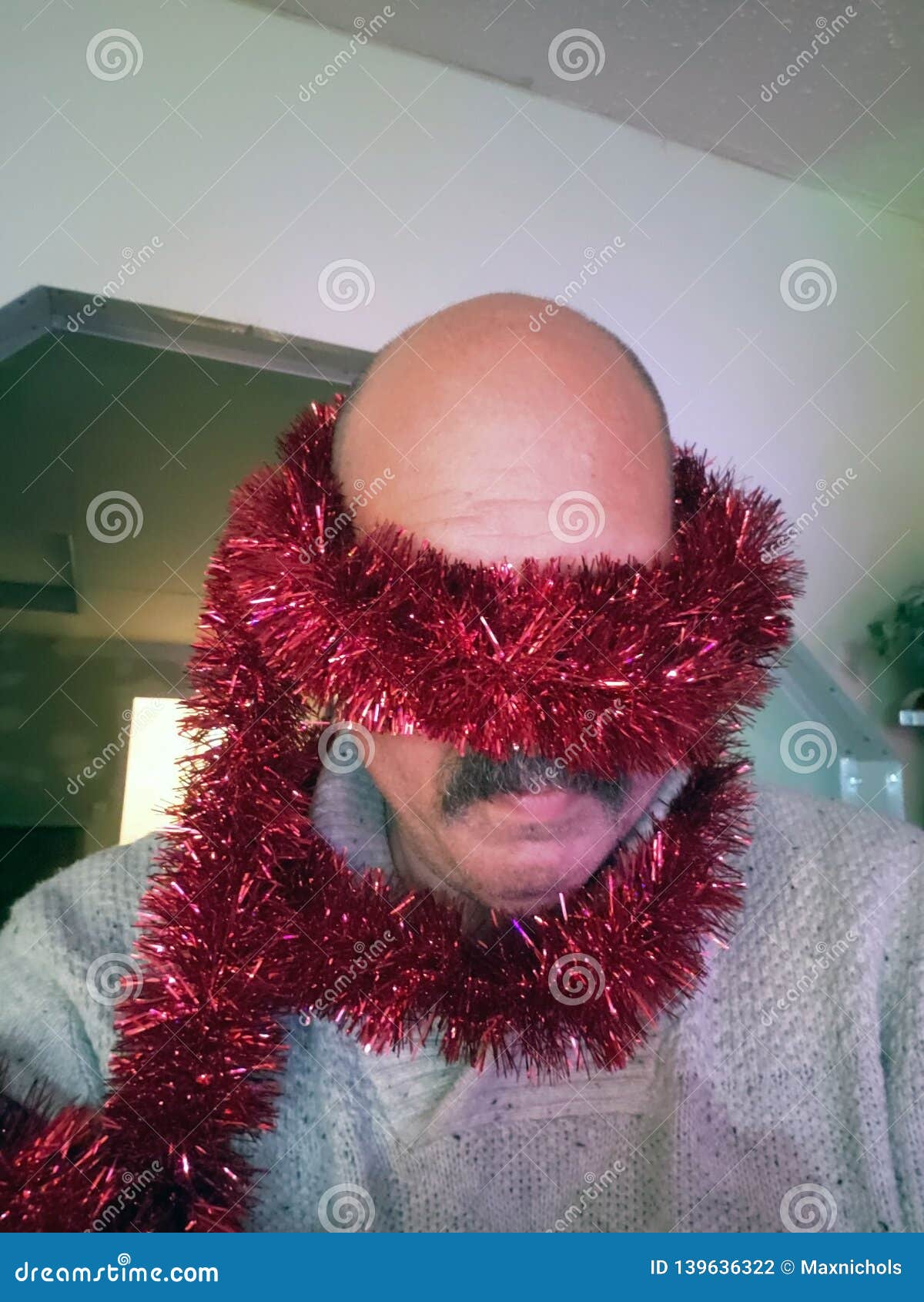 Man Wearing Red Garland Blindfold Stock Photo - Image of playful ...