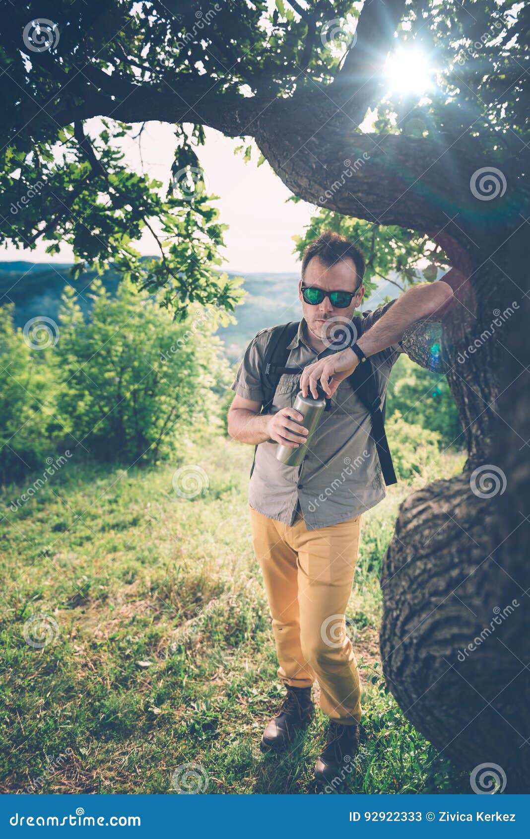 Man resting under the tree stock image. Image of mountain - 92922333