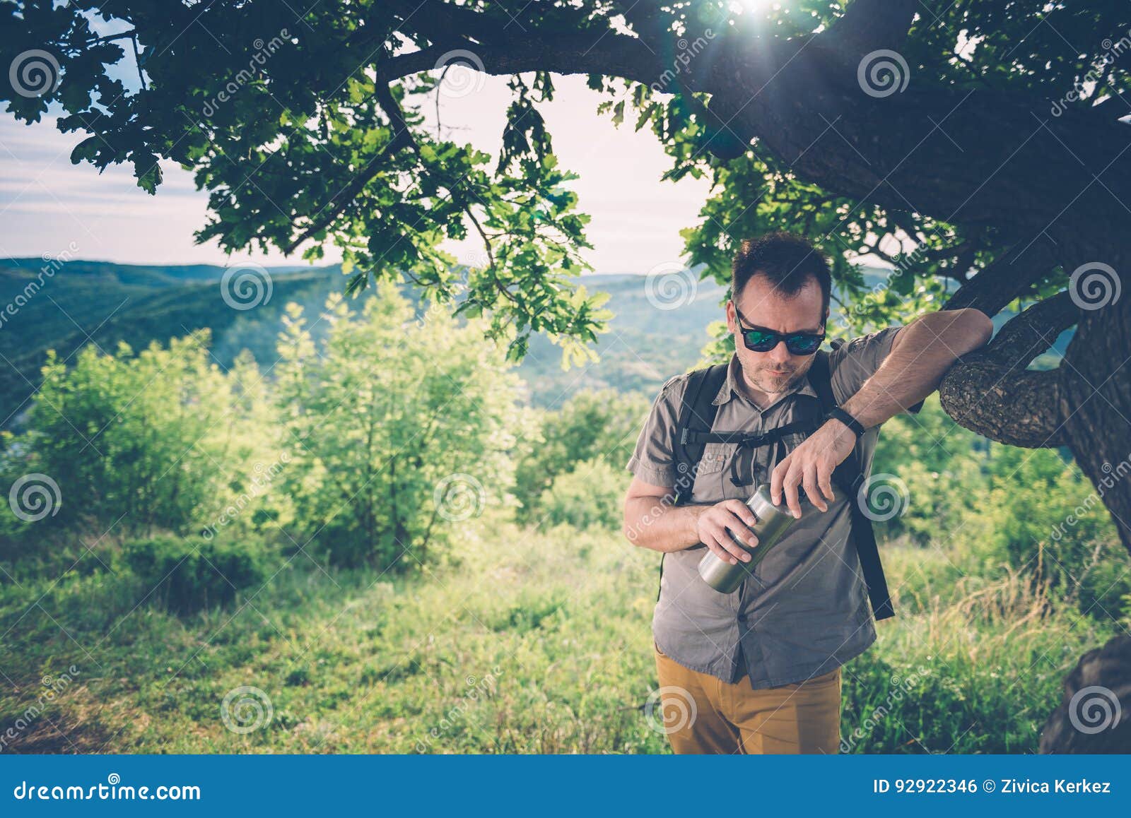 Man resting under the tree stock photo. Image of contemplating - 92922346