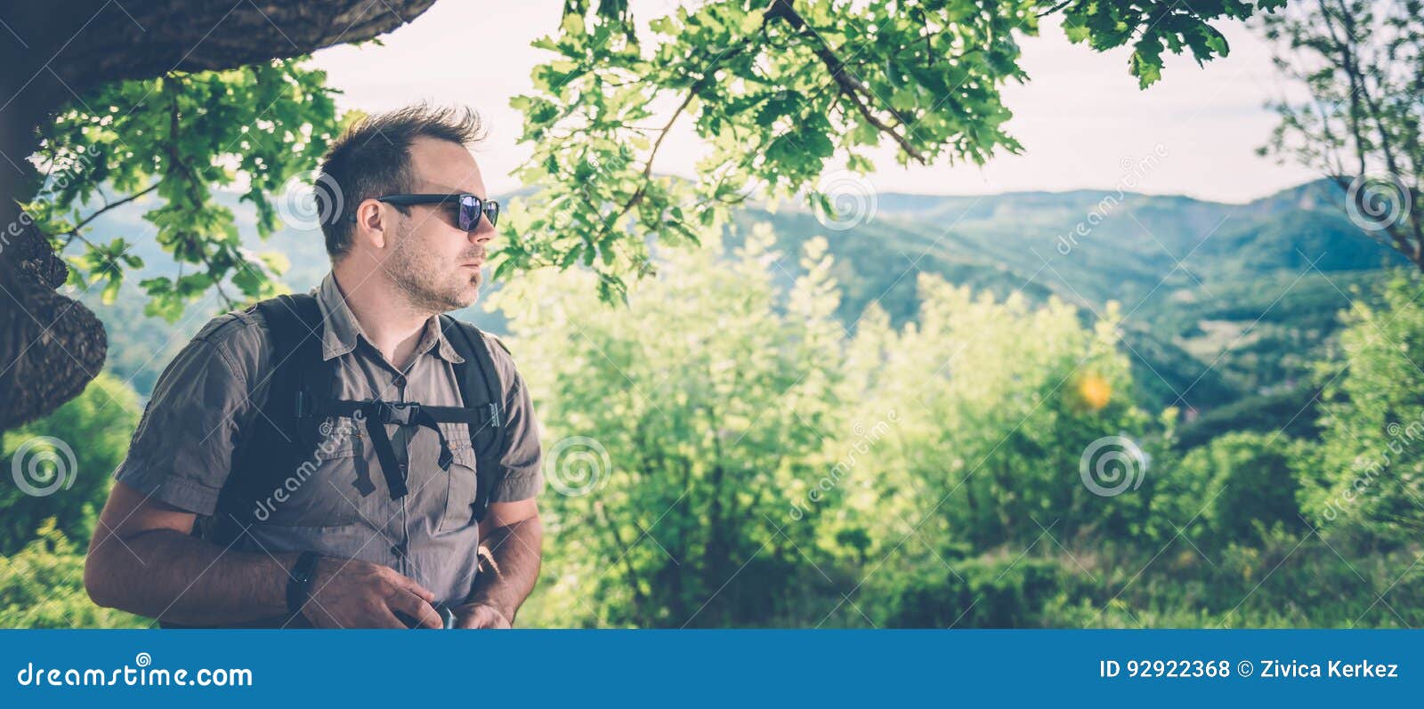 Man resting under the tree stock photo. Image of mountain - 92922368