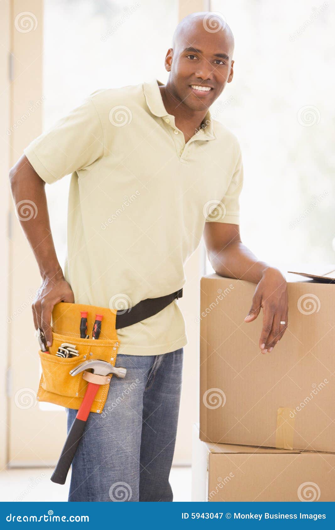 Man Wearing Tool Belt by Boxes in New Home Stock Image - Image of ...