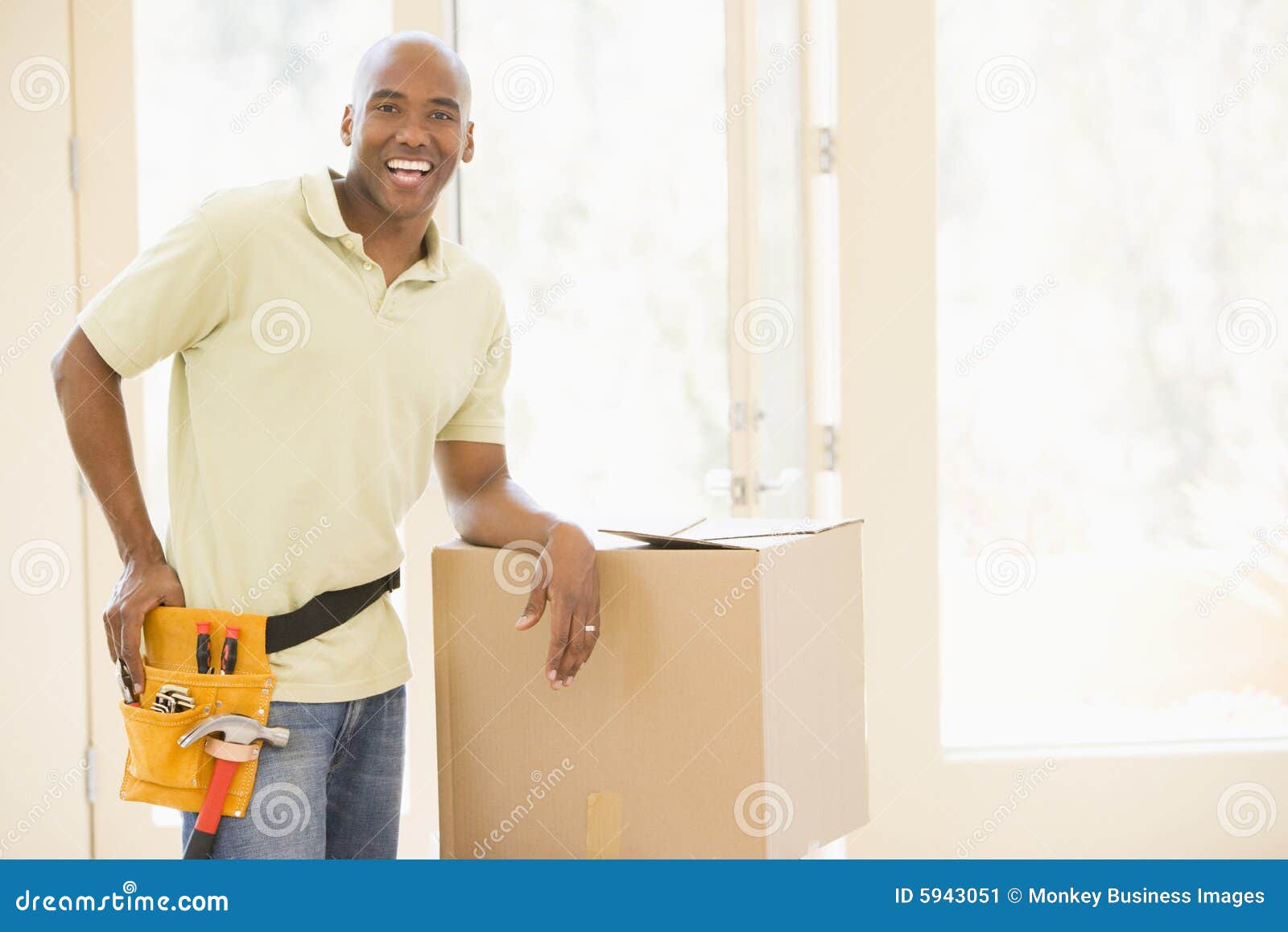 Man Wearing Tool Belt by Boxes in New Home Stock Image - Image of ...