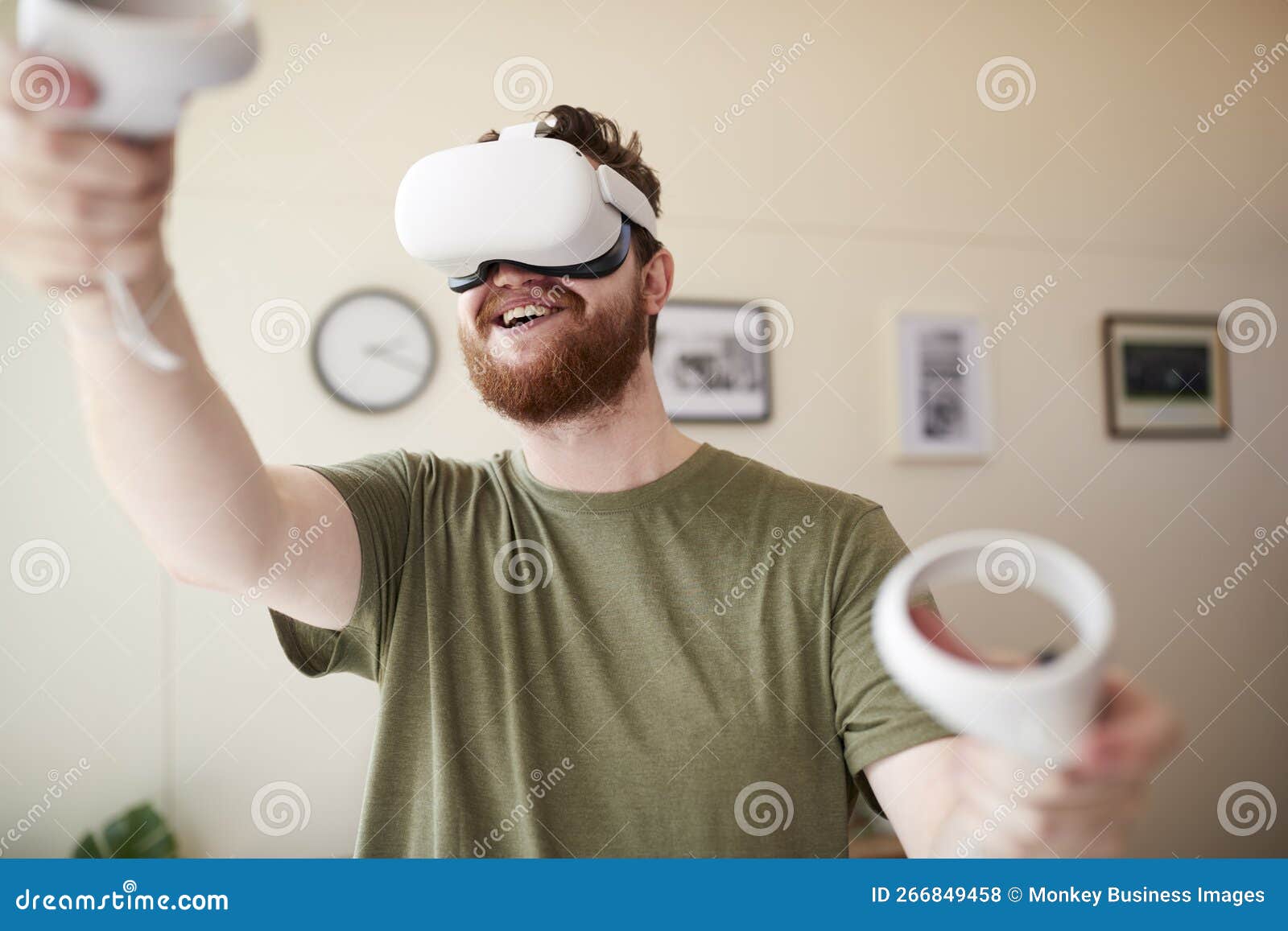 Man Wearing VR Headset Holding Controllers Gaming at Home Stock Photo ...