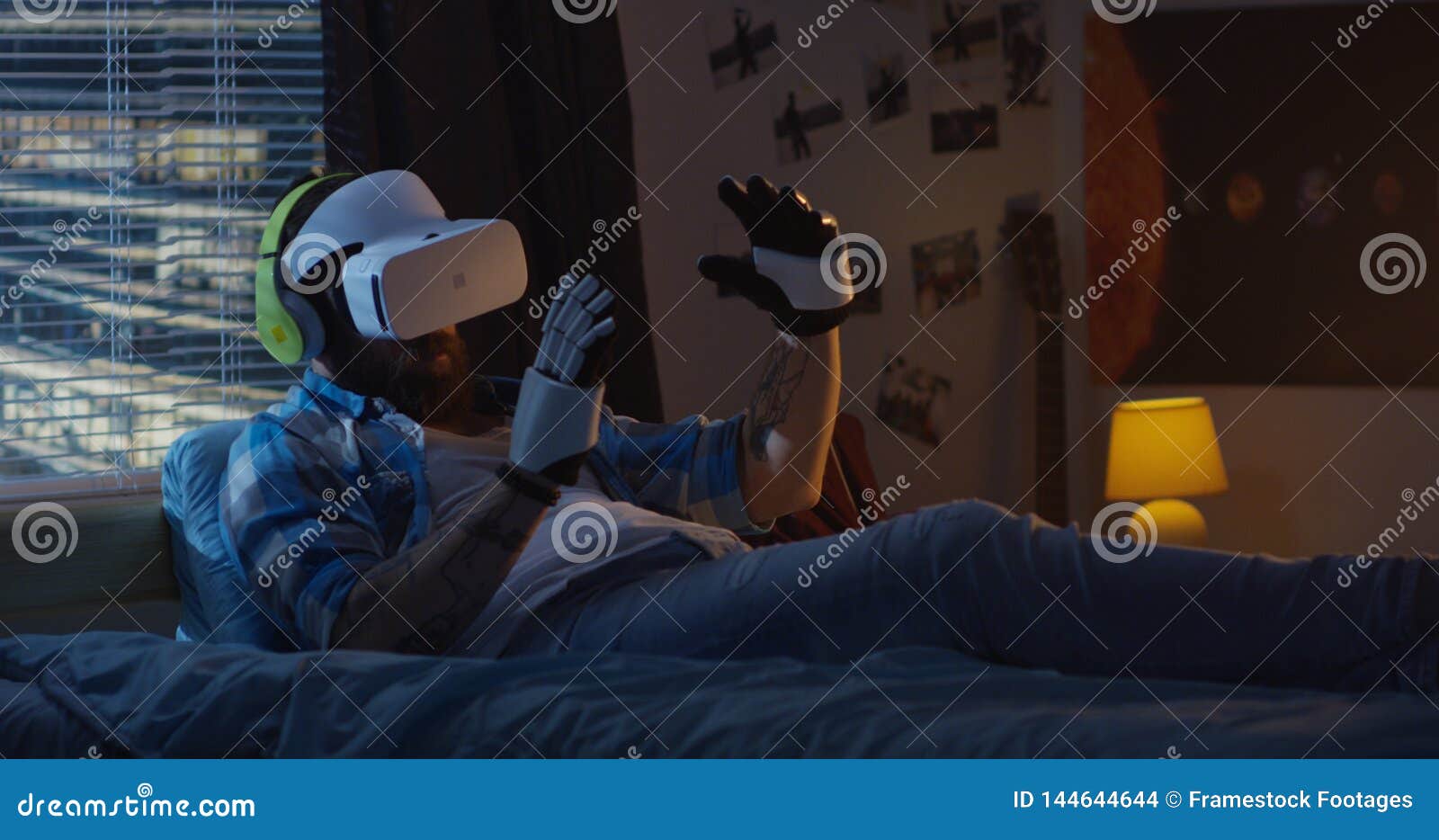 Man wearing VR headset stock photo. Image of bedroom - 144644644