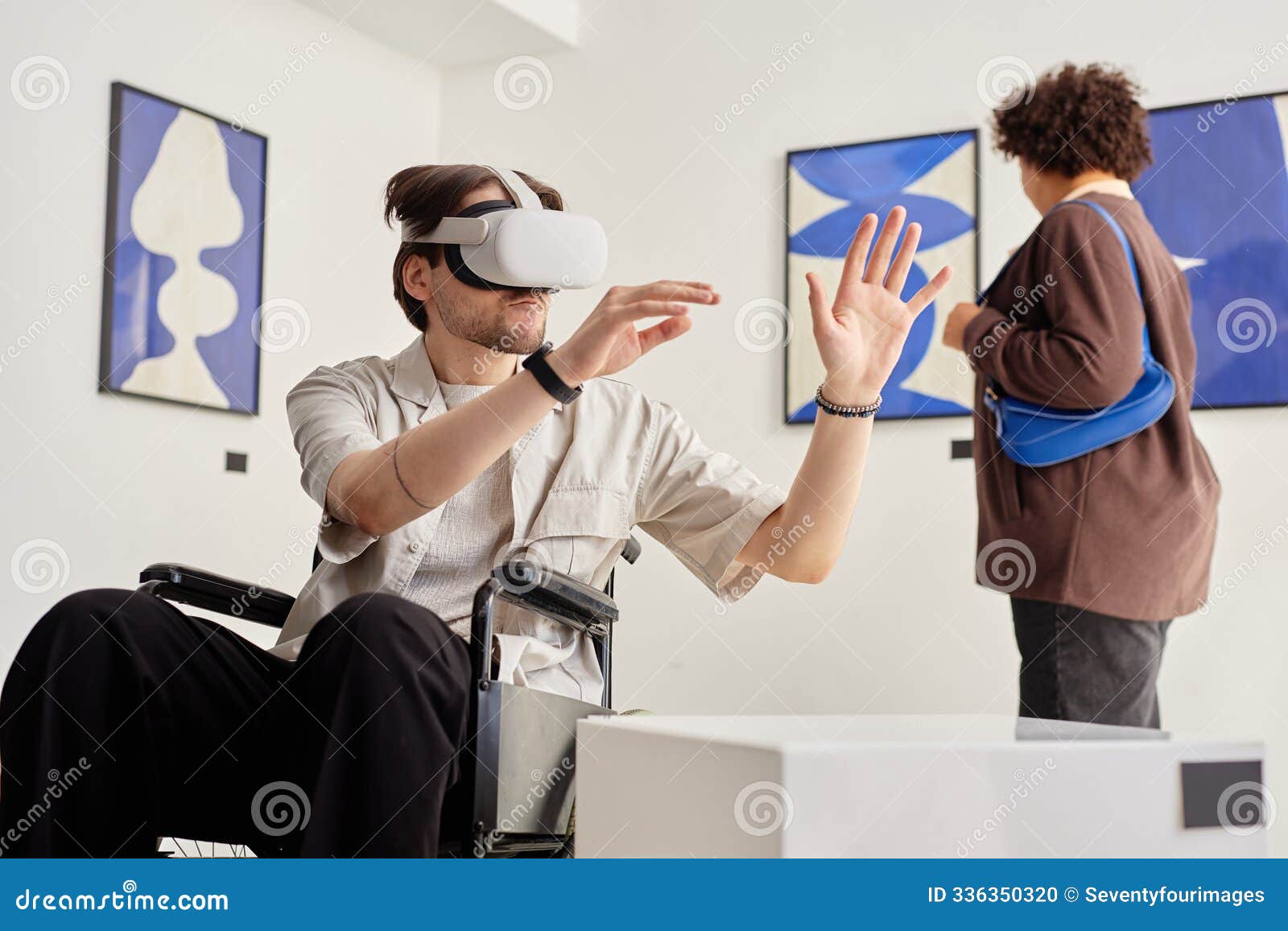 Man Wearing VR Tech Interacting with Artwork in Accessible Art ...