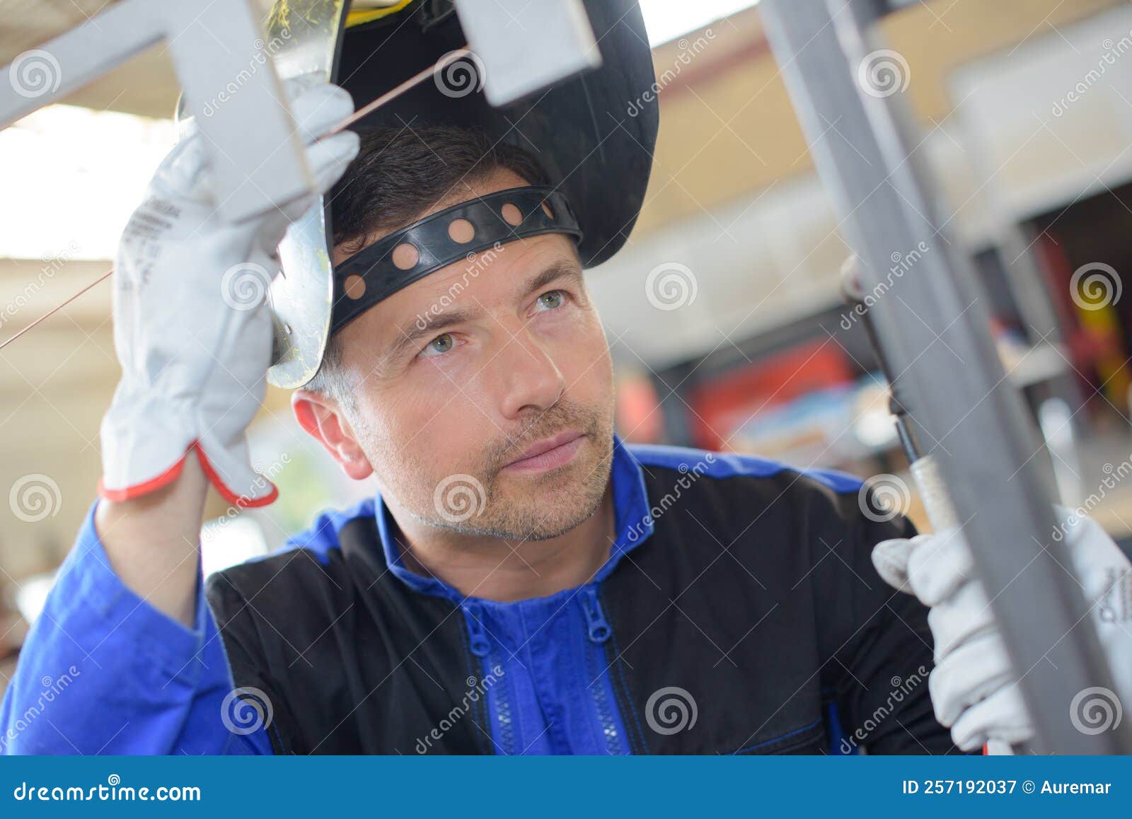 Man wearing welding mask stock image. Image of factory - 257192037
