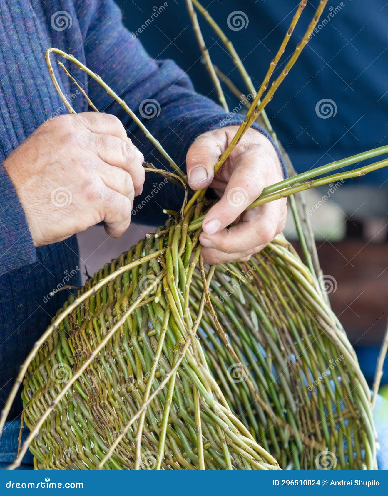 A Man Weaves a Basket with Willow Branches Stock Photo - Image of ...