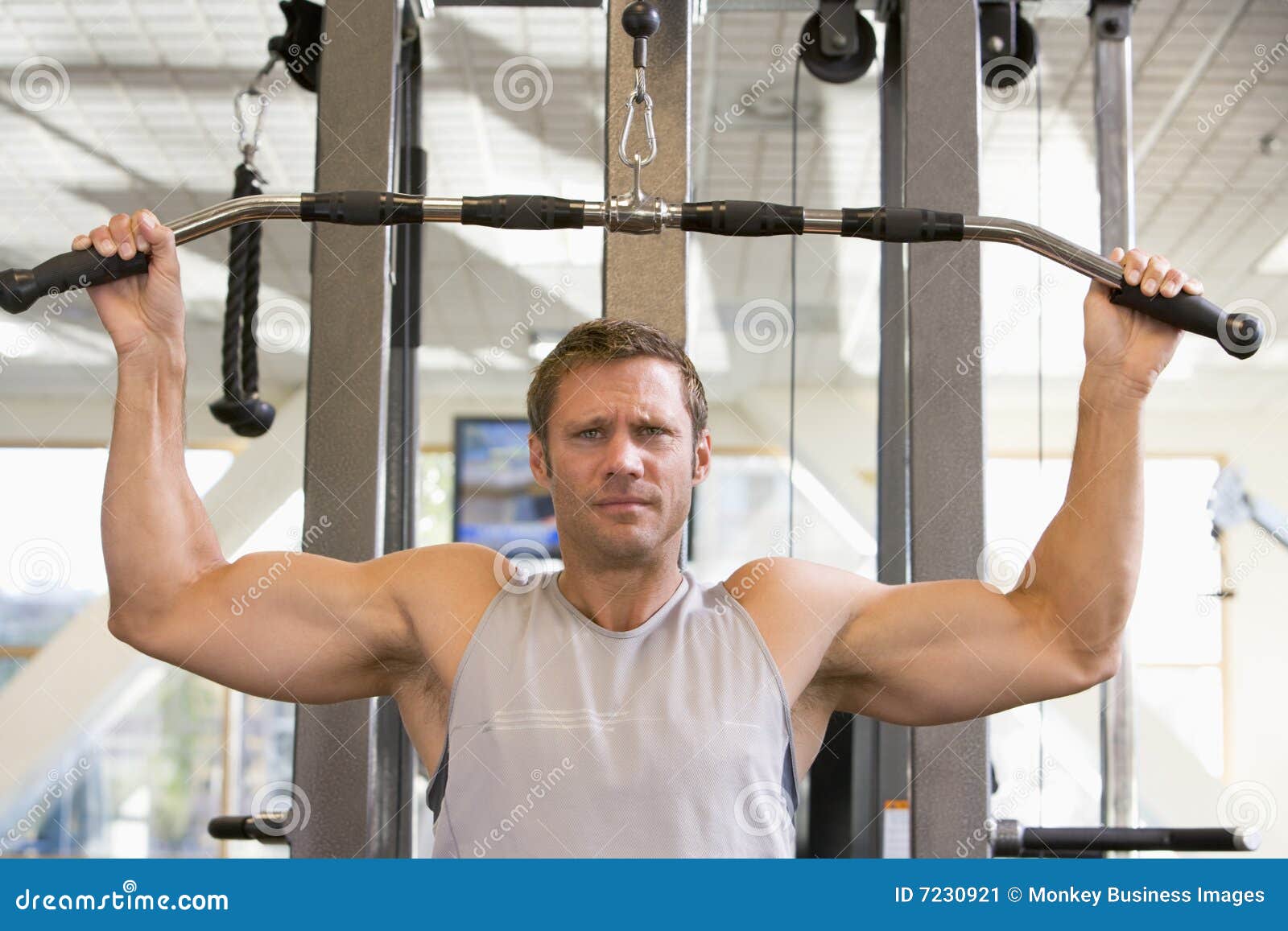 Man Weight Training at Gym stock image. Image of indoors - 7230921