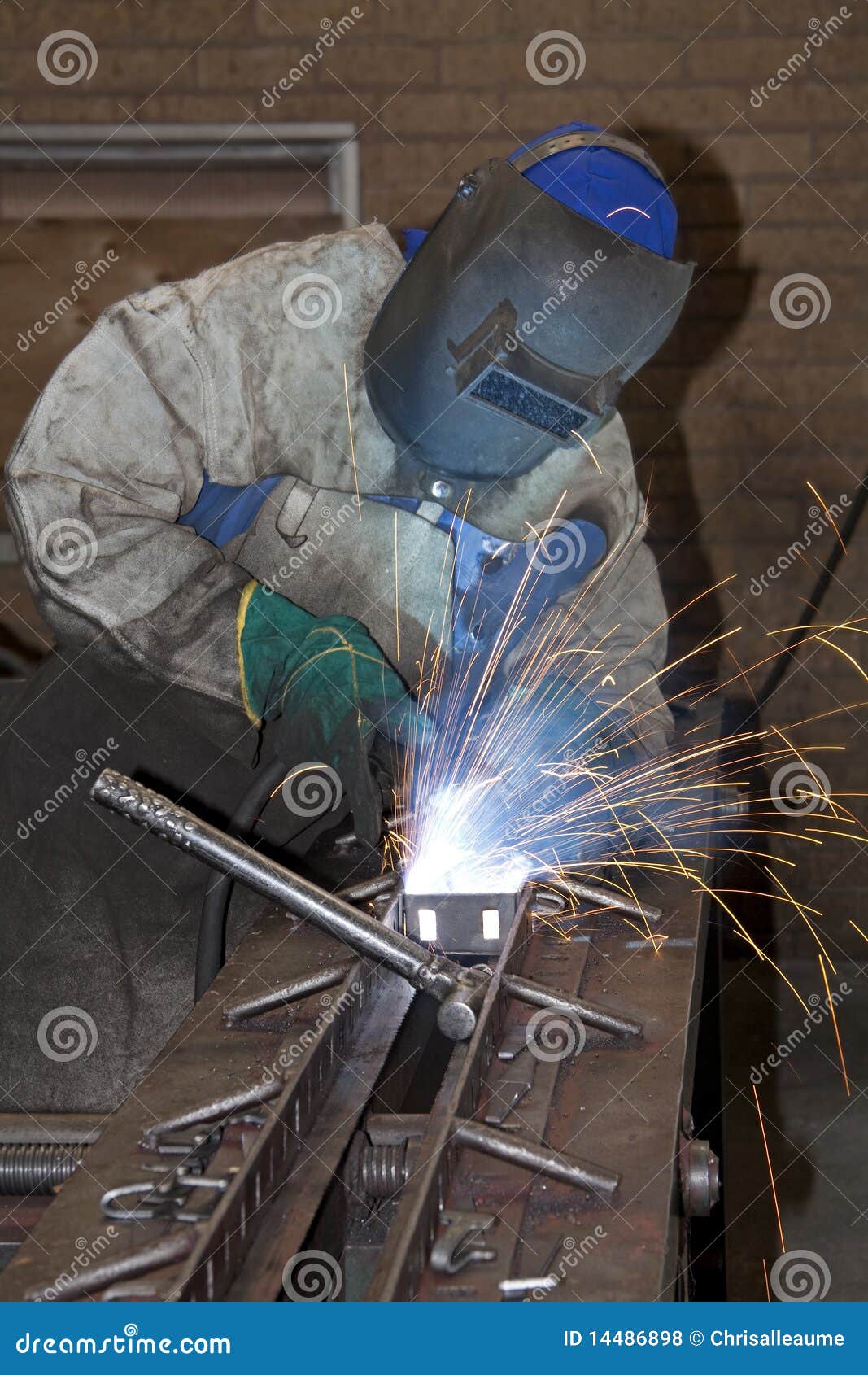 Man Welding On Production Line Stock Photo | CartoonDealer.com #14486898