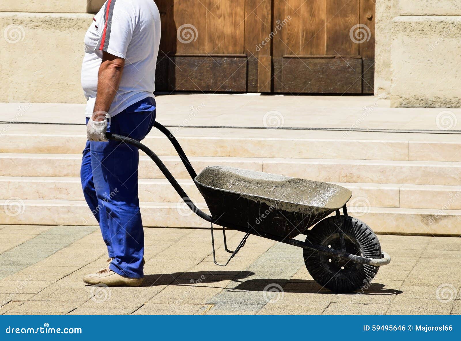 Man with a wheelbarrow stock photo. Image of addition - 59495646