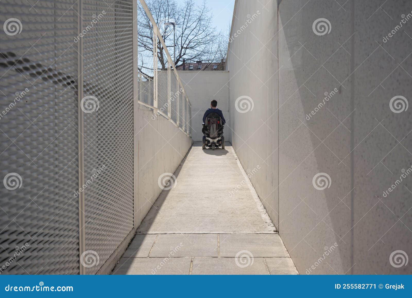 Man on Wheelchair Moving Along an Accessible Ramp Stock Image - Image ...