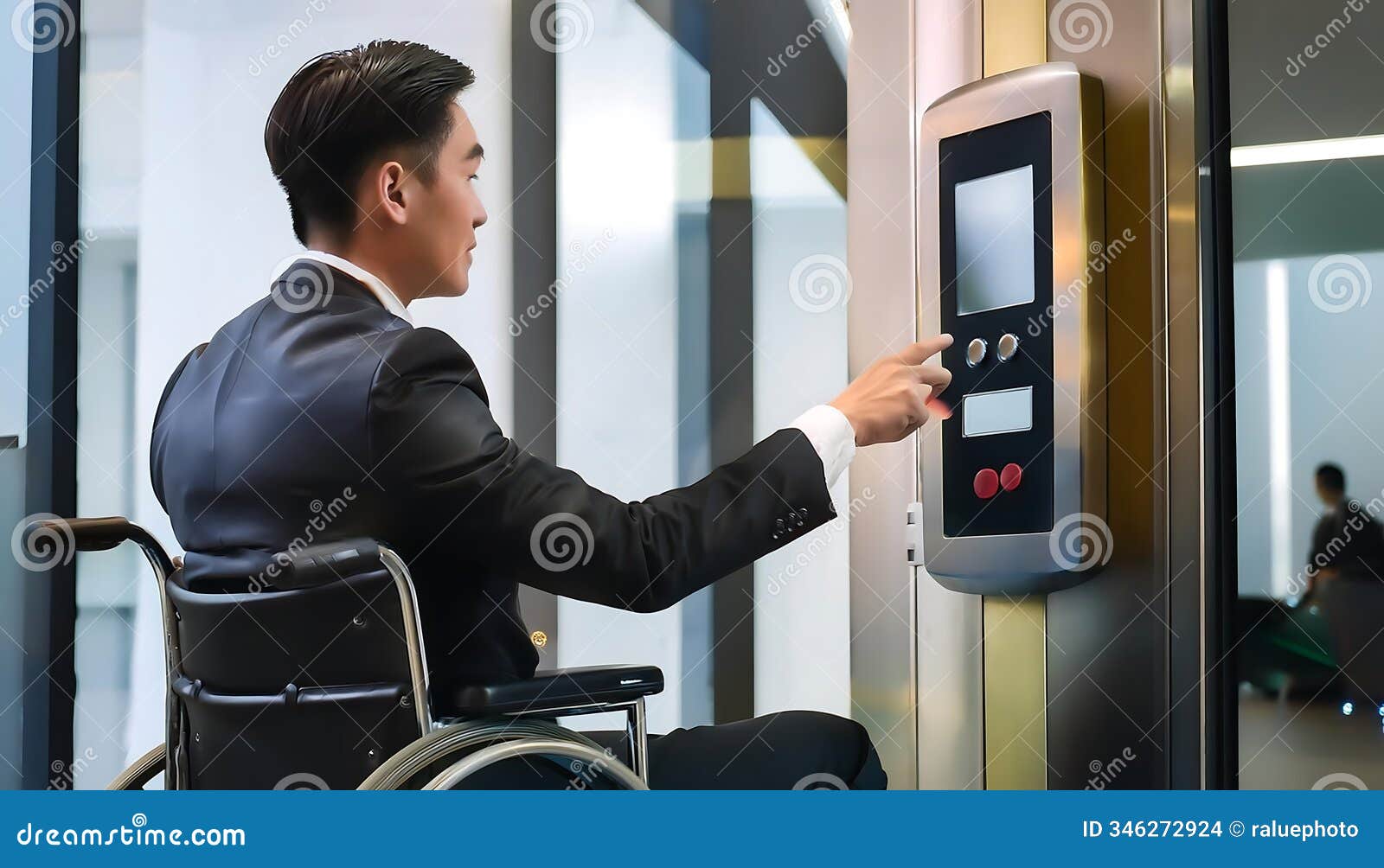 A Man in a Wheelchair Presses a Button on an Elevator Control Panel in ...