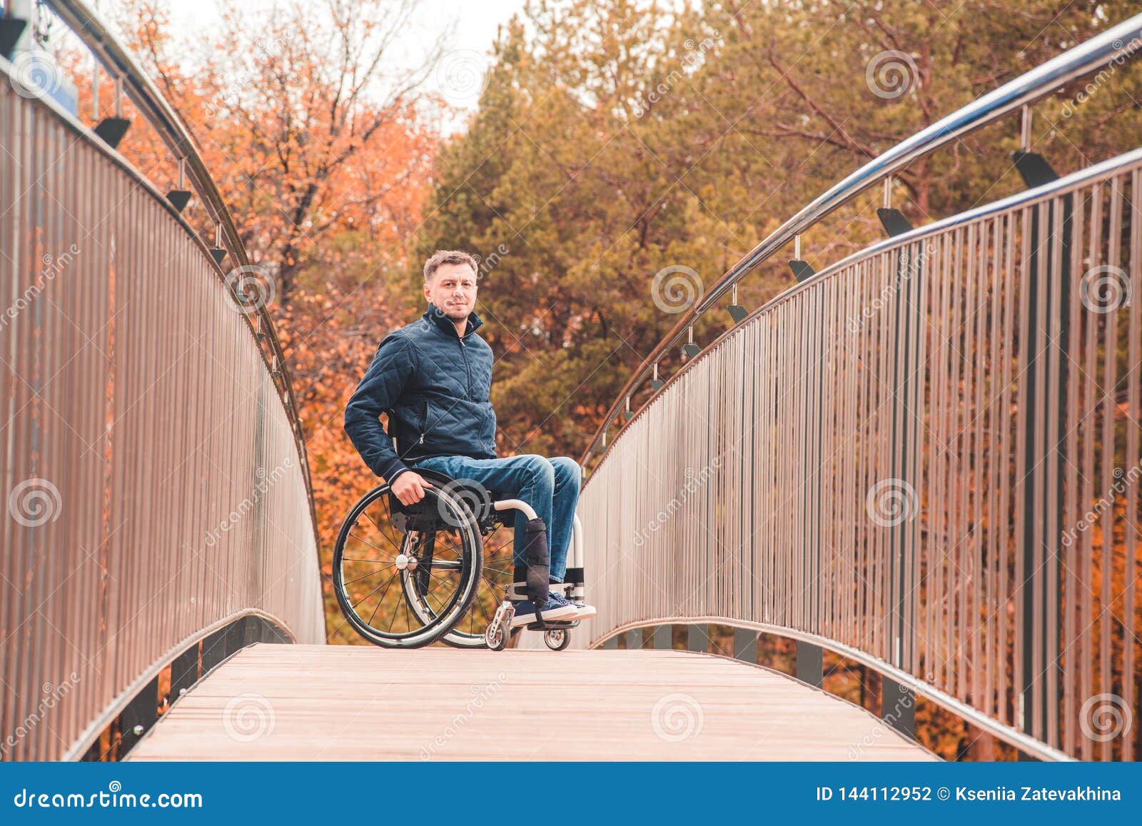 Man in a Wheelchair Use a Wheelchair Ramp. Stock Photo - Image of ...
