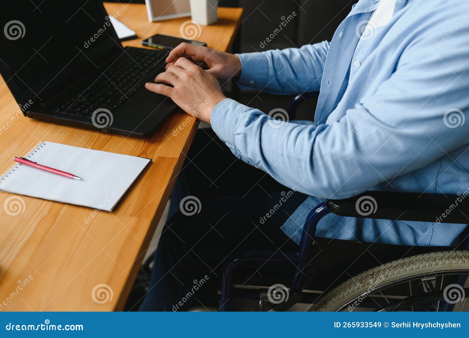 A Man in a Wheelchair is Working in a Office. the Concept of Work of ...