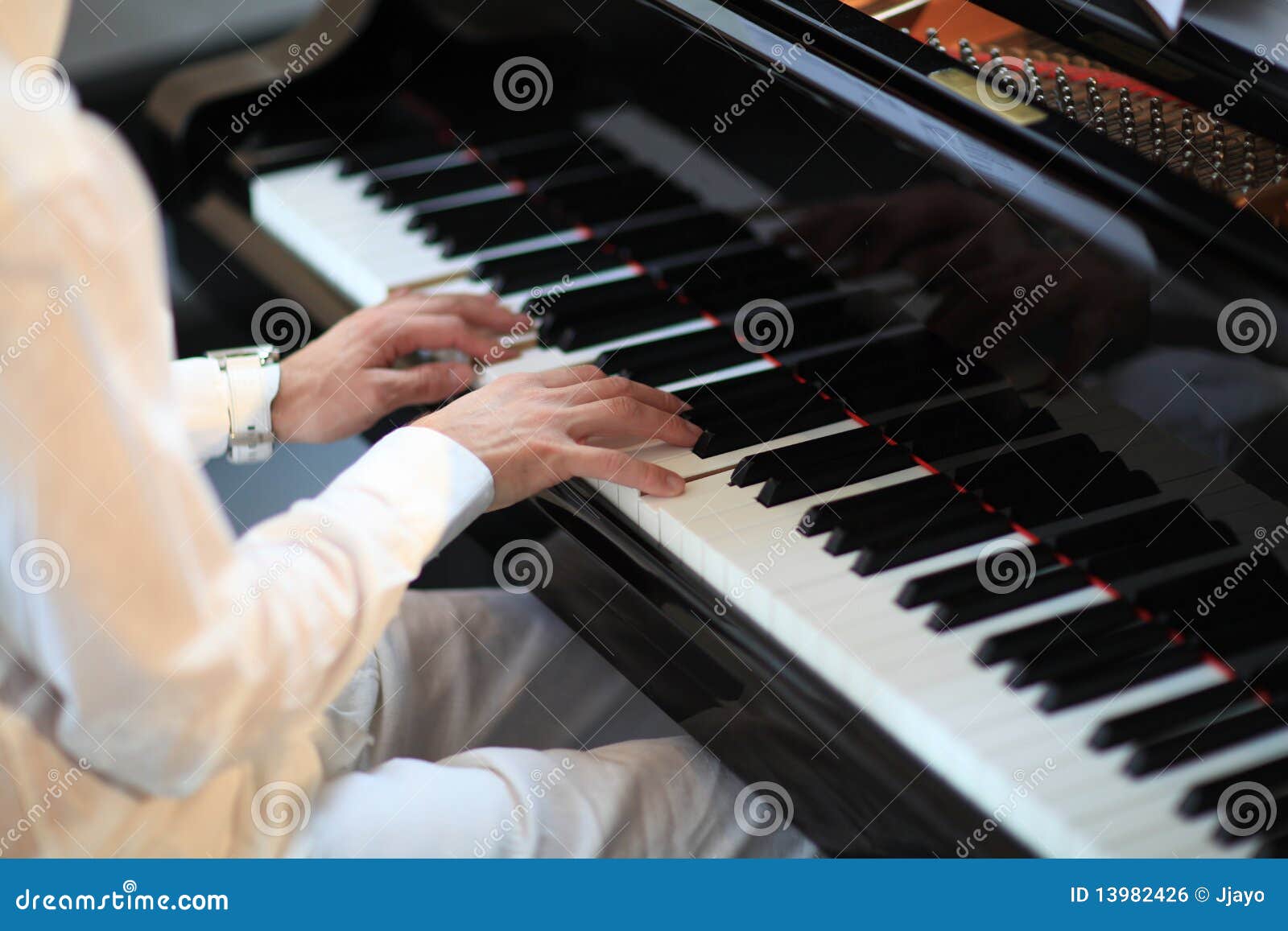 Man In White Playing Grand Piano Royalty Free Stock Image - Image: 13982426