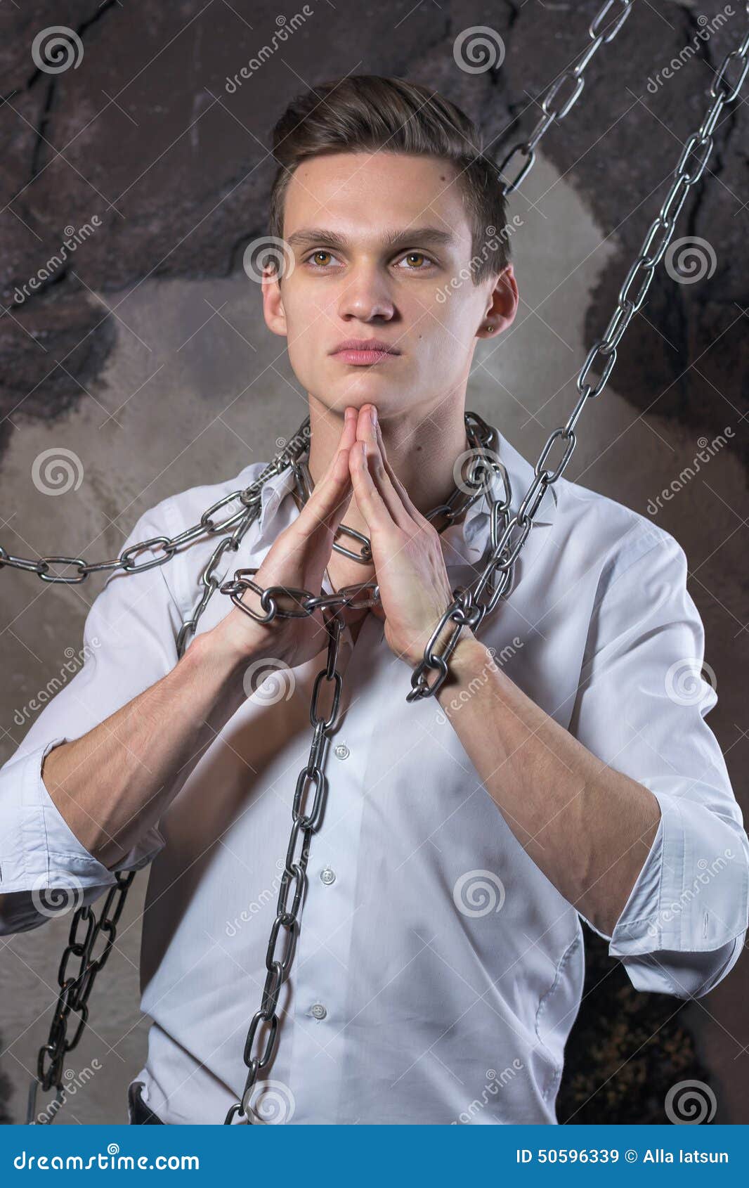 The Man in the White Shirt and Bound in Chains. Stock Image - Image of ...