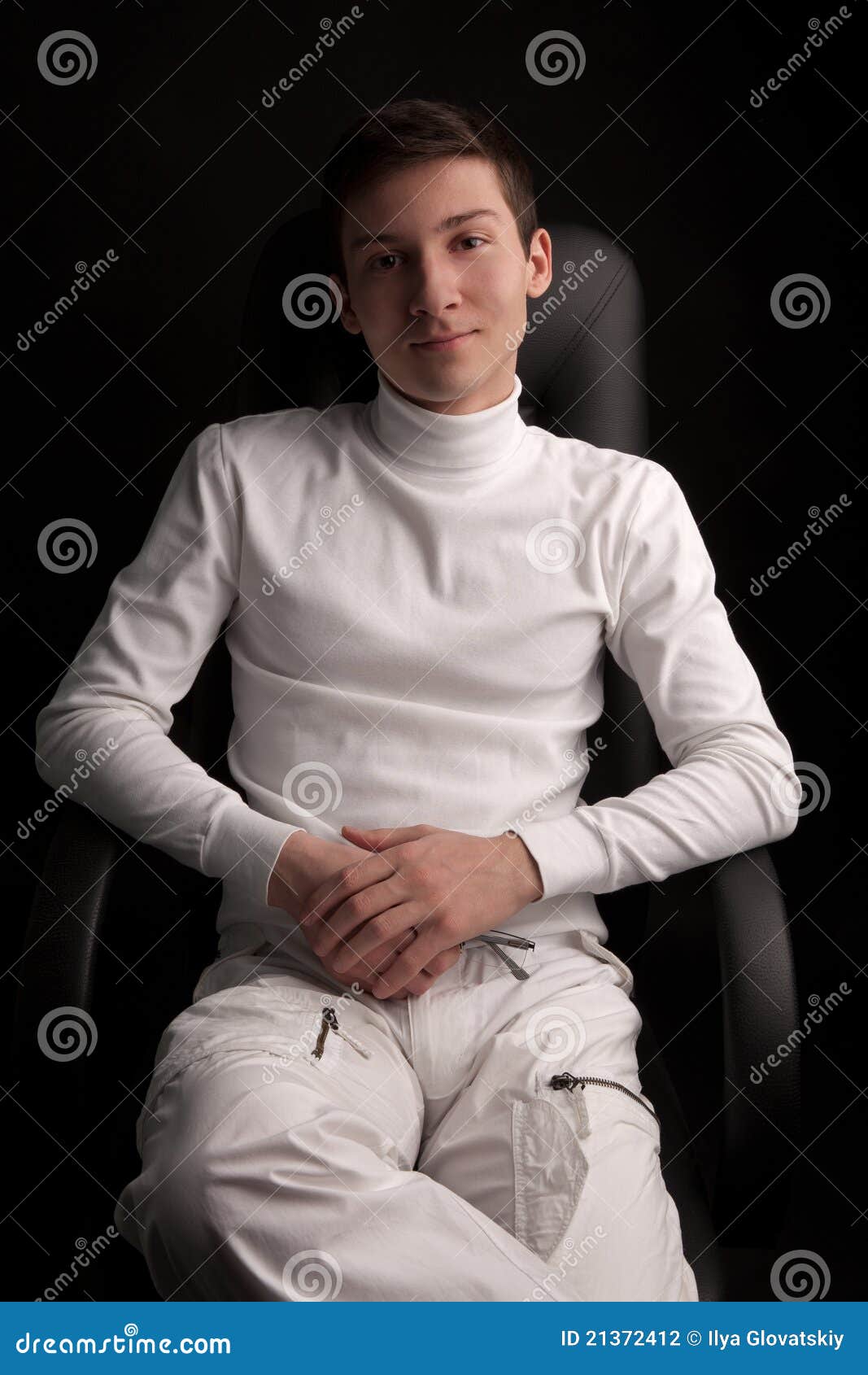 Man in White Sitting in Armchair Stock Photo - Image of thinking, hands ...