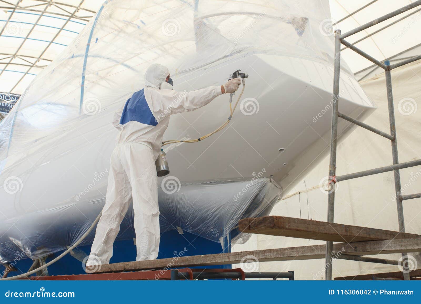 Man Spraying Paint To the Boat Editorial Photography - Image of coating ...