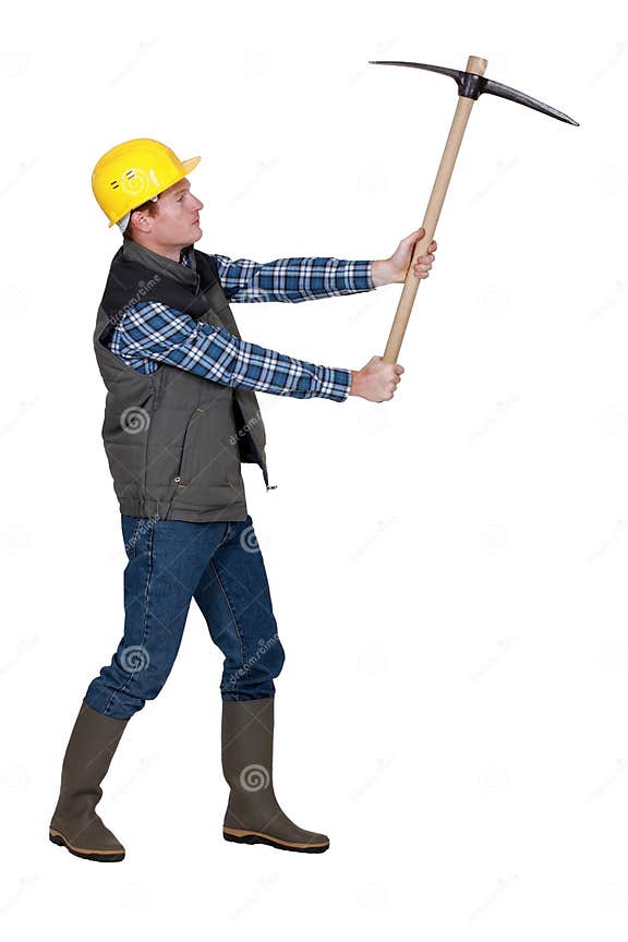 Man wielding pick-axe stock photo. Image of dirt, laborer - 30592598