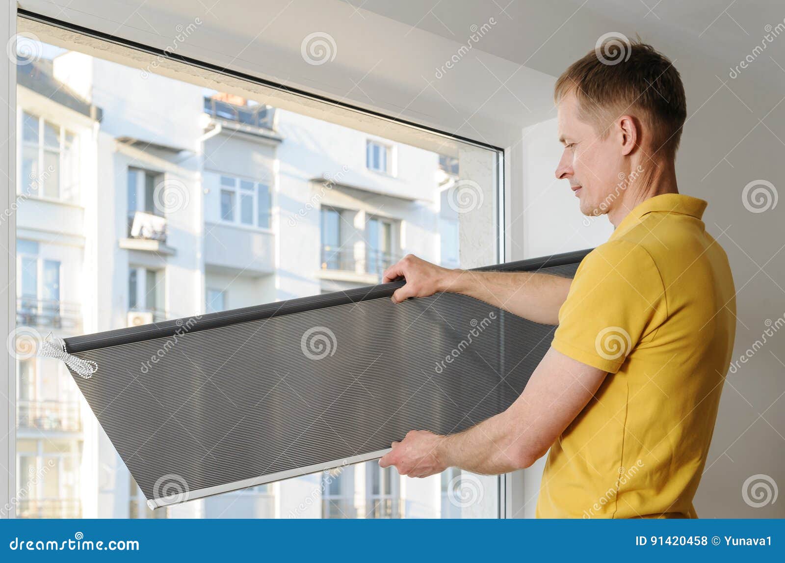 Man with window blind. stock photo. Image of shadow, renovation - 91420458