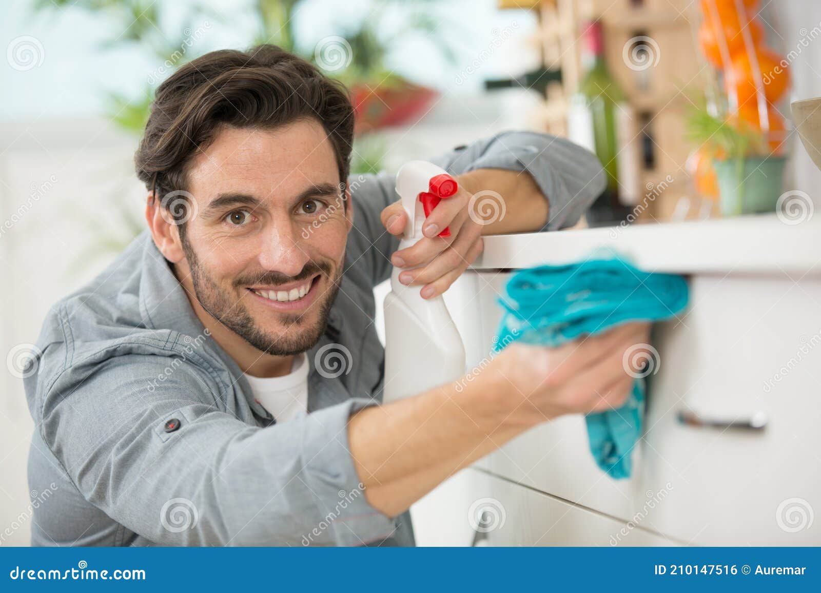 Man Wiping Down Kitchen Cupboard Stock Photo - Image of people, clean ...