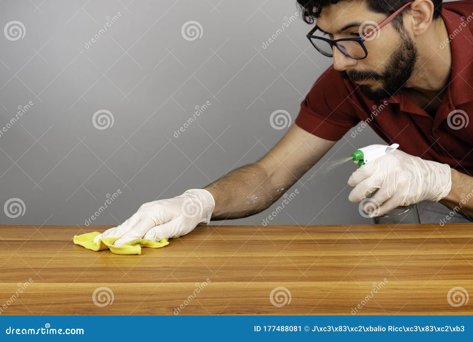 Man Wiping Down Office Desk Surfaces with 70 Alcohol Stock Image ...