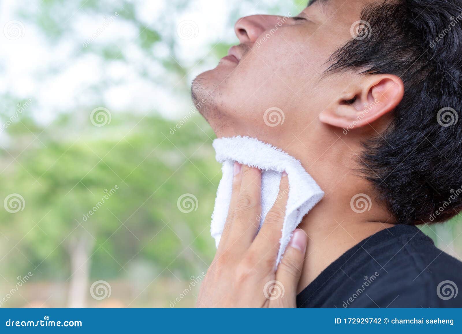 Man Wiping Off the Sweat in the Parks Stock Photo - Image of looking ...