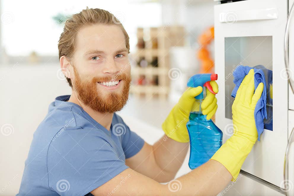 Man Wiping Oven with Table Cloth Stock Photo - Image of oven, indoor ...
