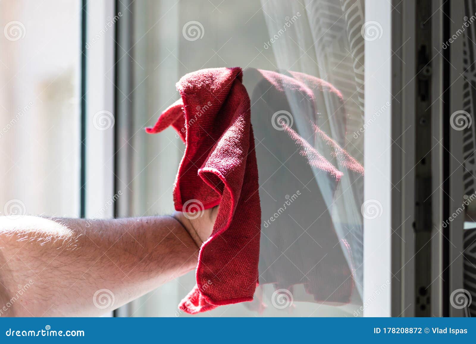 Man Wiping Window Using Red Microfiber Rug, Cleaning Services Concept ...