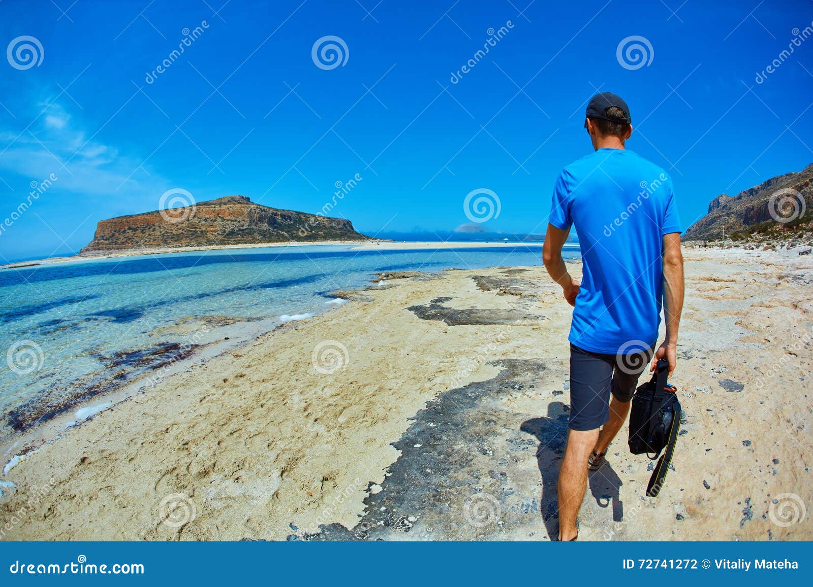 Man wolking on the beach stock photo. Image of island - 72741272