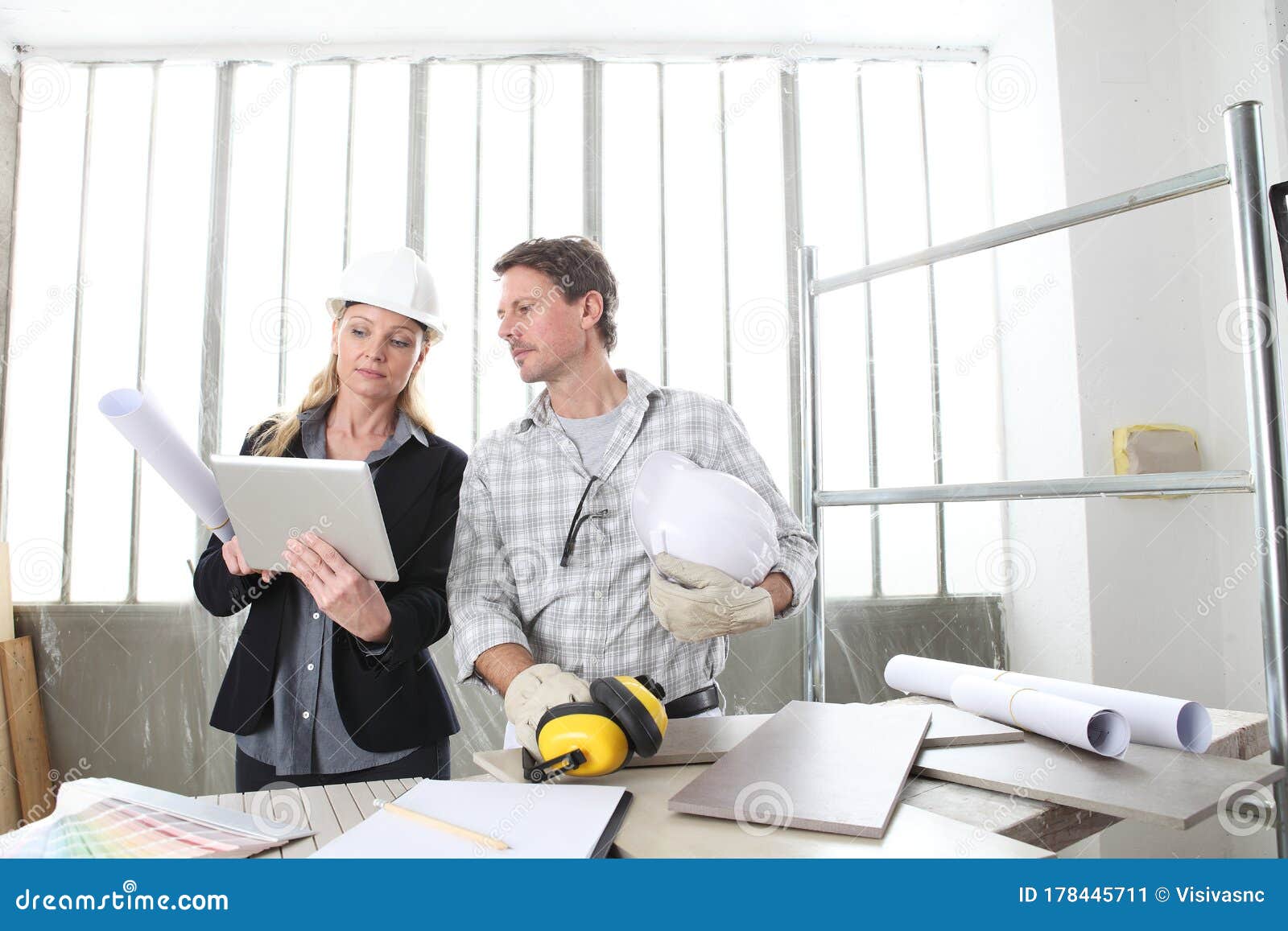 Man and Woman Architect Interior Designer and Foreman Worker Together ...
