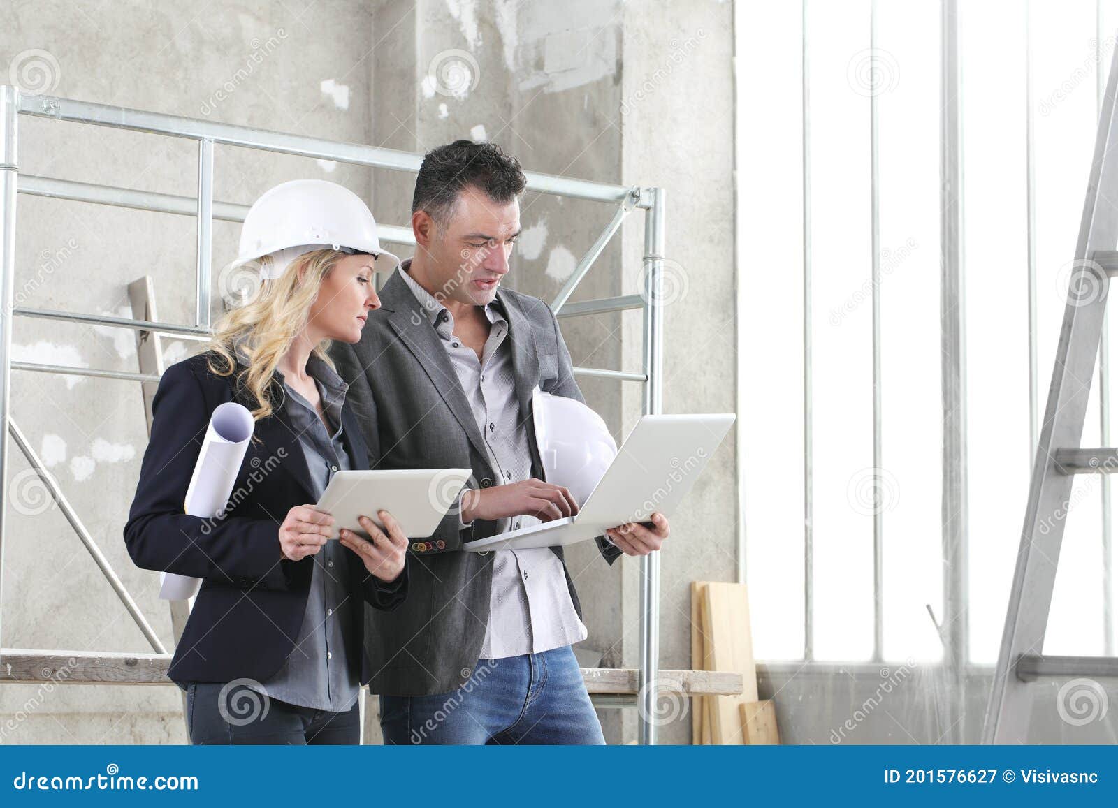 Man and Woman Architects or Engineers with Computer Work Together in ...