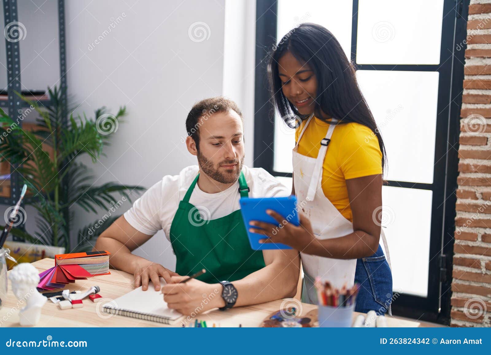 Man and Woman Artists Drawing on Notebook Using Touchpad at Art Studio ...