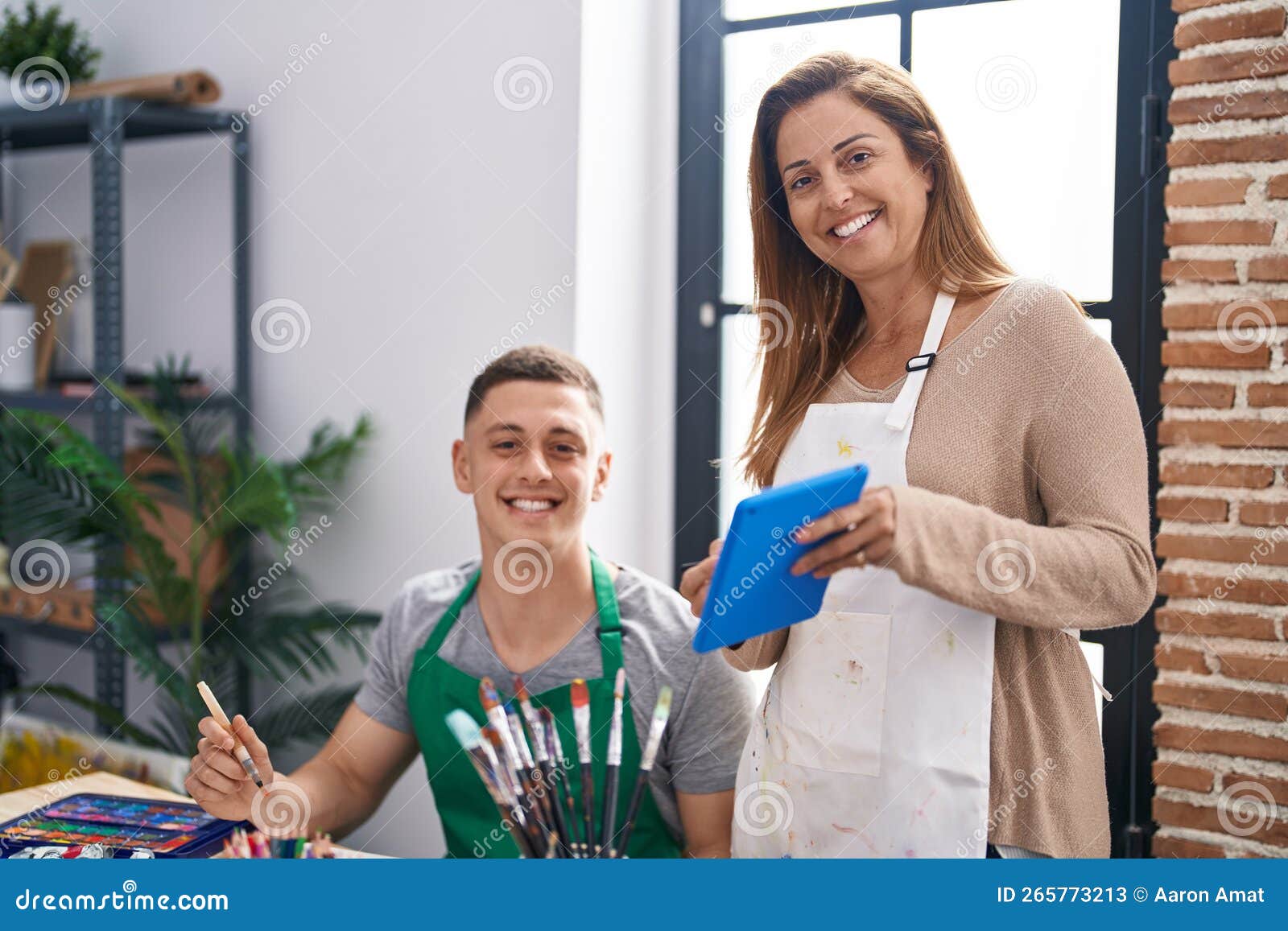 Man and Woman Artists Drawing on Notebook Using Touchpad at Art Studio ...