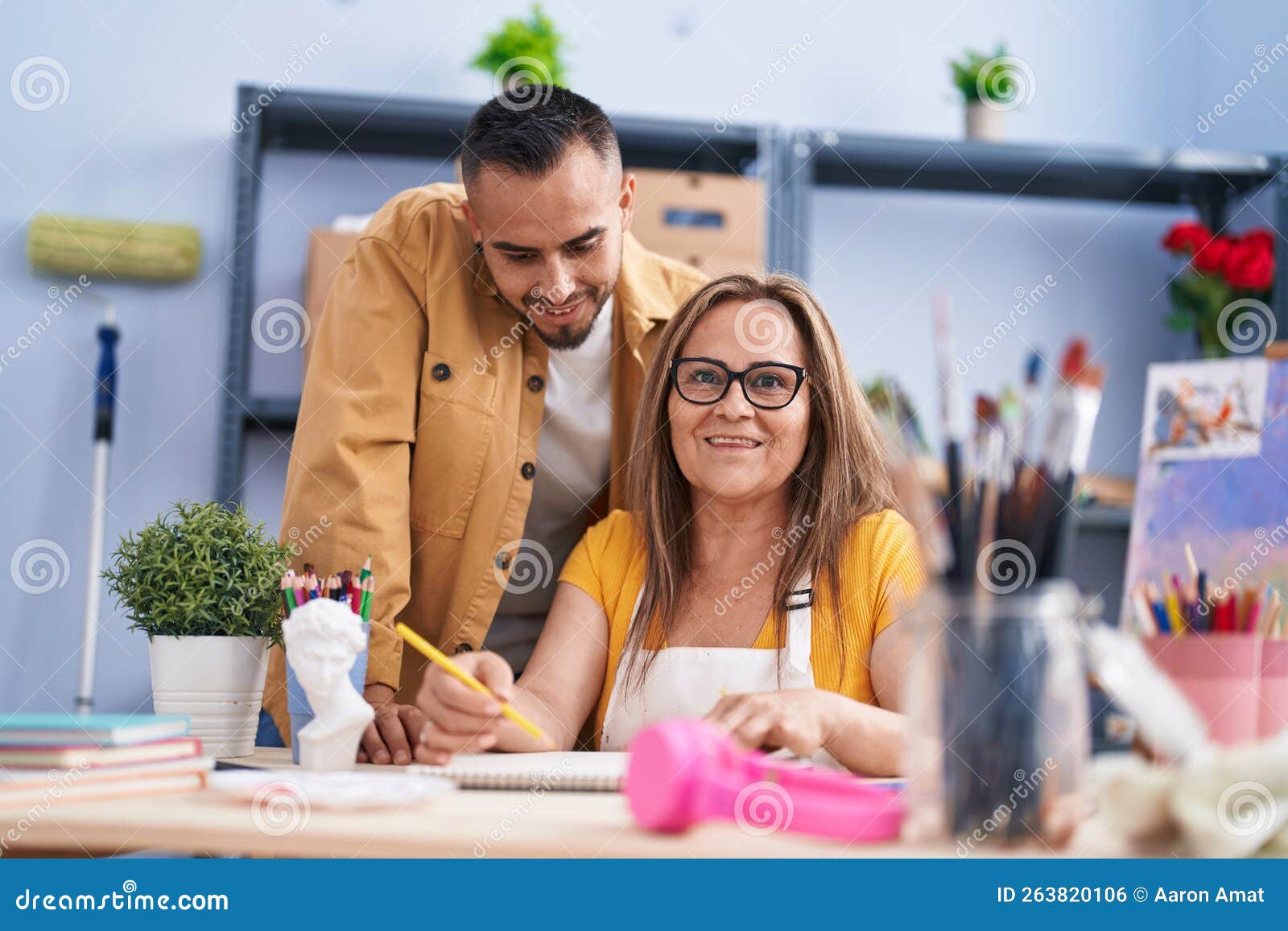 Man and Woman Artists Smiling Confident Drawing on Notebook at Art ...