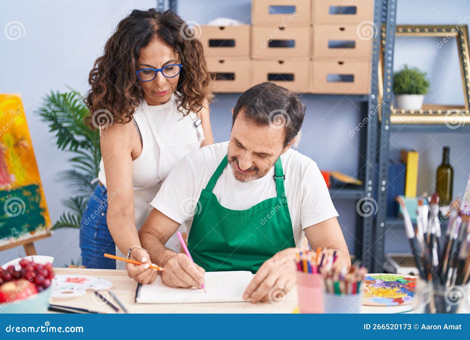 Man and Woman Artists Smiling Confident Drawing on Notebook at Art ...