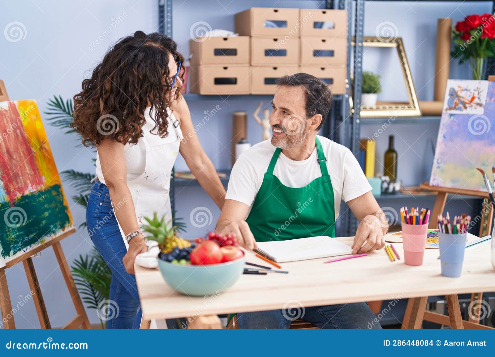 Man and Woman Artists Smiling Confident Drawing on Notebook at Art ...