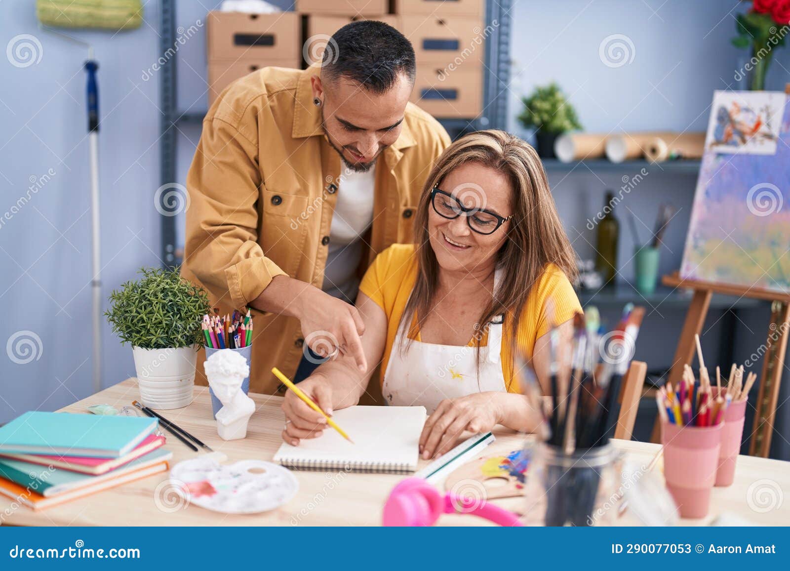 Man and Woman Artists Smiling Confident Drawing on Notebook at Art ...