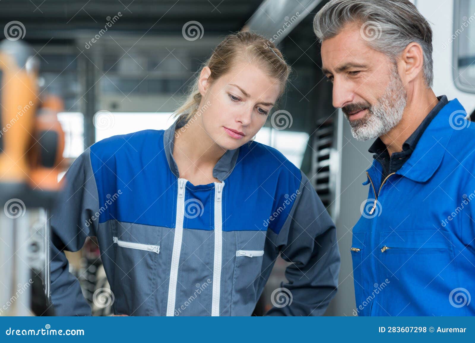 Man and Woman Auto Mechanics in Car Workshop Stock Photo - Image of ...