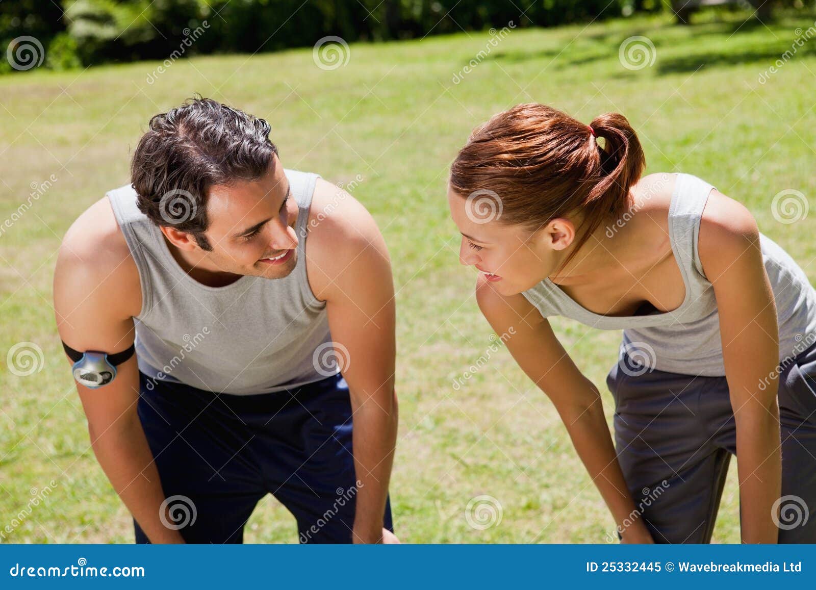 Man and a Woman Bending Over while Looking at Each Other Stock Image ...