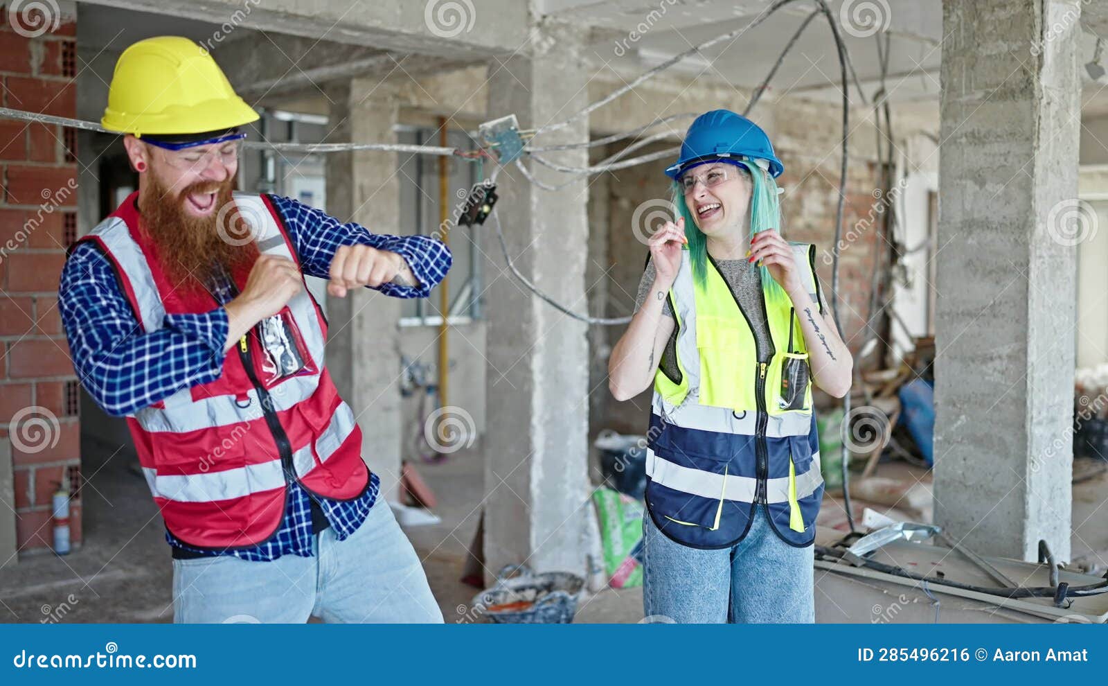 Man and Woman Builders Smiling Confident Dancing at Construction Site ...