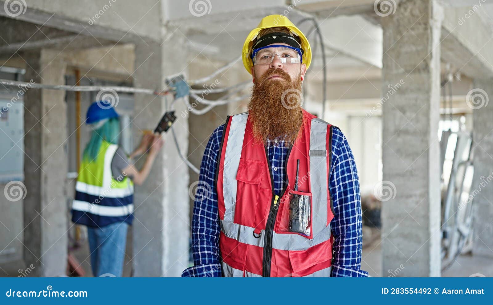 Man and Woman Builders Standing with Relaxed Expression Working at ...