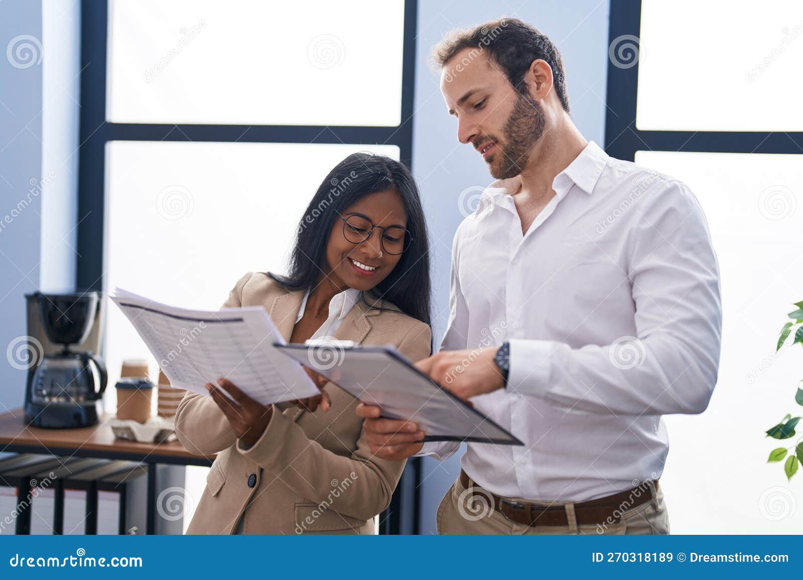 Man and Woman Business Workers Reading Document Standing Together at ...